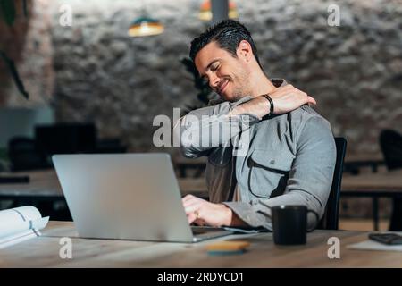 Architect taking break after using laptop in office Stock Photo - Alamy