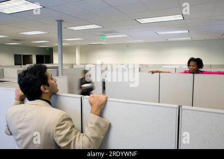 office workers talk over cubicle walls Stock Photo - Alamy