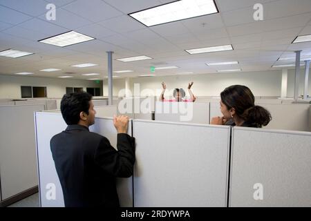 office workers talk over cubicle walls Stock Photo - Alamy