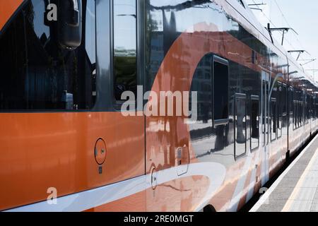 Modern passenger electric train arrives at the station in Tallinn Stock ...