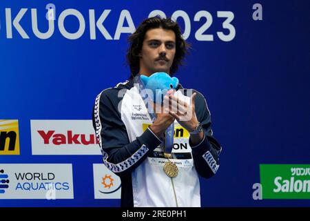 Thomas Ceccon of Italy poses with his gold medal after winning the men's 50m butterfly final at ...