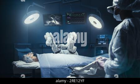 Two Surgeons Observing High-Precision Programmable Automated Robot Arms ...