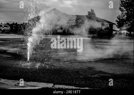 A fountain of sparks, flames, and smoke emitting from a fountain ...