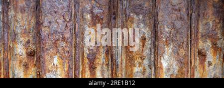 A section of heavily rusted and corroded iron breakwater Stock Photo ...