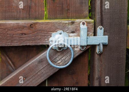 Ring handled gate latch in close up on a gate Stock Photo - Alamy