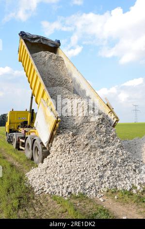 Agriculture: marl limestone soil enriching agent on a field. Addition ...