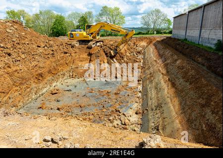 Construction of a manure pit, geomembrane installation, to collect ...