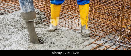 worker is concreting the floor of new built huose Stock Photo - Alamy