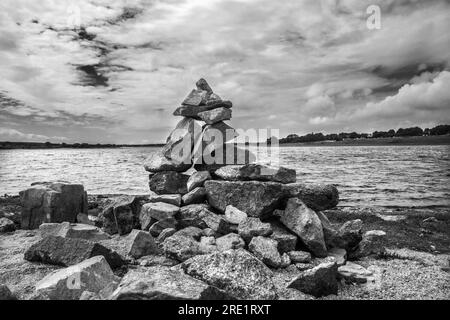 A pile of rocks on the foreshore of Colliford reservoir, Lake ,on ...