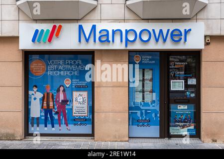 Sign and logo of a Manpower office. Manpower is a brand of the ...