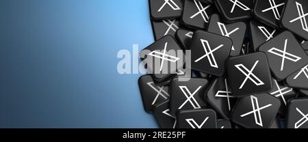 Twitter has been renamed to X by X Corp. Logos of X Corp. on a table ...