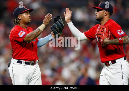 Cleveland Guardians' Jose Ramirez, right, steals second base as ...