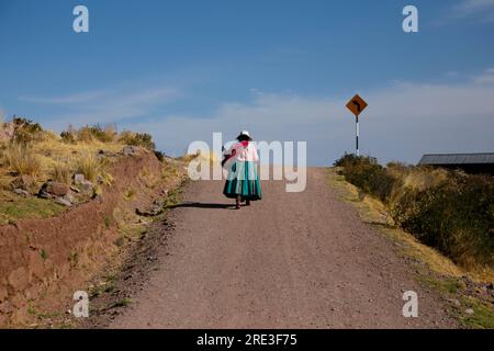 Traditional stone arch of the Llachon peninsula, in the Lake Titicaca ...