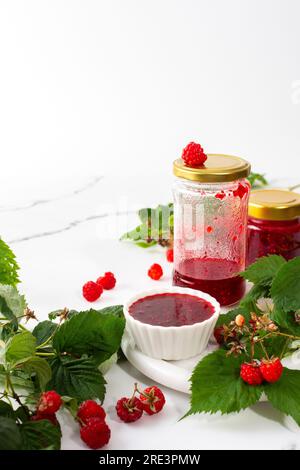 Jars of raspberry jam and raspberries Stock Photo - Alamy