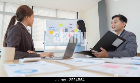 Business team of financial analyze about company's graph profit ...