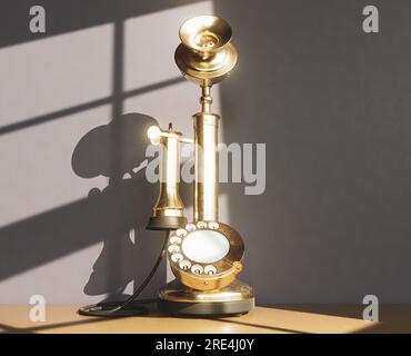 A vintage retro candlestick bell telephone made of brass on a shelf in ...