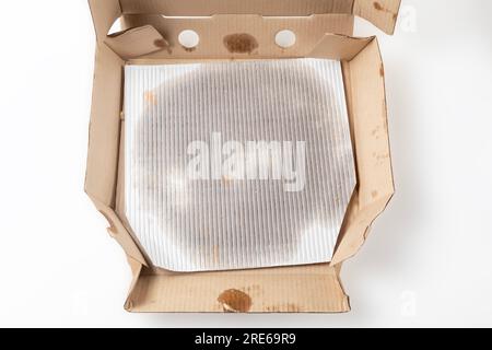 Empty pizza box with grease stains isolated on white. Top view Stock ...