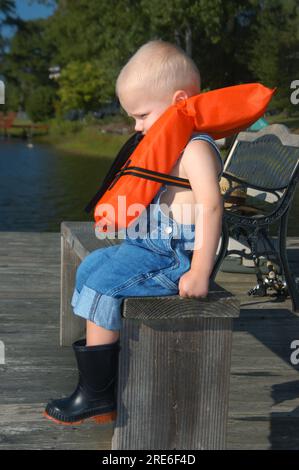 little boy wearing a life preserver Stock Photo - Alamy