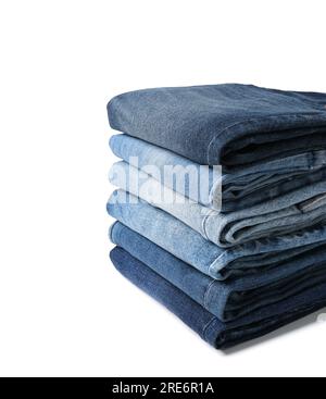 Stacks of different folded jeans isolated on white Stock Photo - Alamy