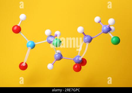 Structure of molecule on yellow background. Chemical model Stock Photo ...