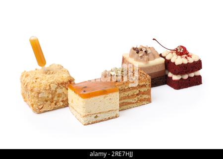 Pieces of different cakes on white background Stock Photo - Alamy