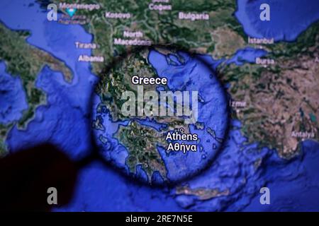 Greece on wildfire. Greece on maps through magnifying glass Stock Photo ...
