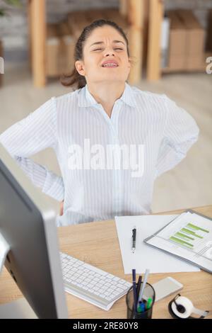 Business women having back pain Stock Photo - Alamy