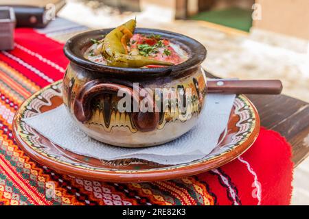 Typical dish of Bulgaria - Gyuveche. Meal baked in a clay pot Stock ...