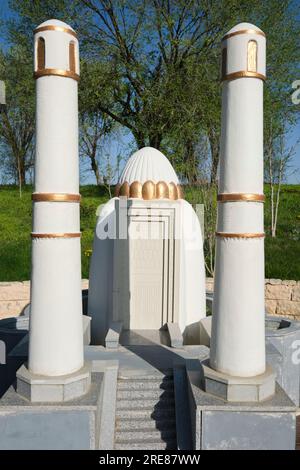 A view of the unique, white, moderne masoleum of Aomaak. A diorama ...