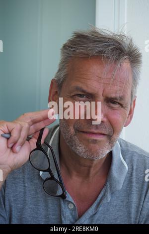 Older Man Tanned With Glasses Stock Photo - Alamy