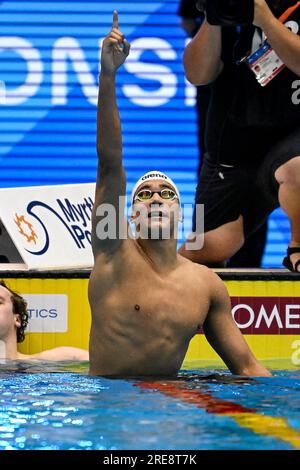 Ahmed Hafnaoui, of Tunisia, celebrates after winning the final of the ...