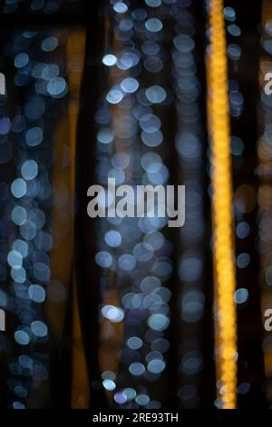 glowing lights of garlands in the form of white branches against the ...