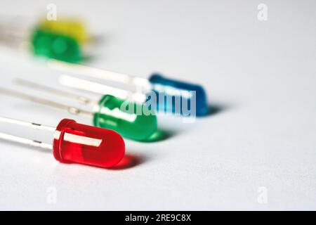 A row of Through Hole led diodes, red and blue color, electronic ...