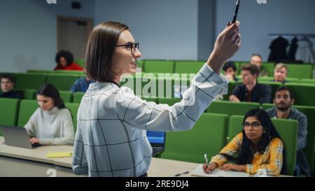 professor talking to students in a modern classroom Stock Photo - Alamy