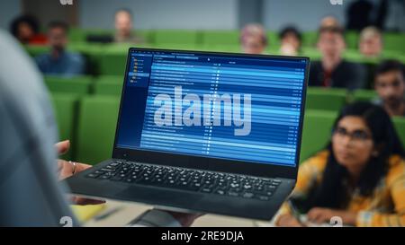 Close Up of an University Professor Using a Laptop Computer with ...