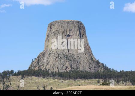 Devil's Tower National Monument, a rare form of igneous rock, rises out ...