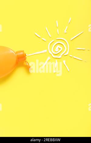 Drawing of sun made with sunscreen cream on yellow background Stock ...