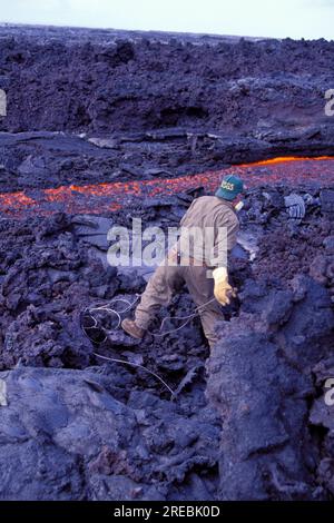 Volcanologist measuring lava flow from Kilauea, the worlds most active ...