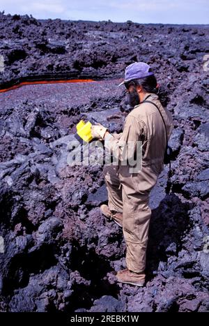 Volcanologist measuring lava flow from Kilauea, the worlds most active ...