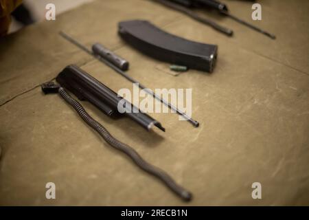 Disassembled machine. Military training. Weapon parts. Firearm. Machine ...