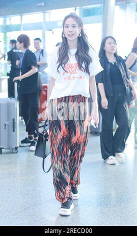 Chinese singer and actress Fei appears at the airport in Changsha City ...