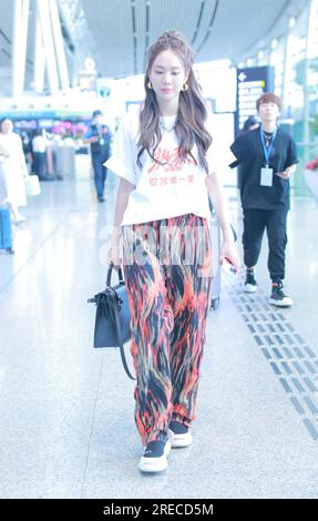 Chinese singer and actress Fei appears at the airport in Changsha City ...
