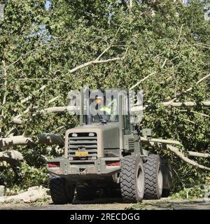 Civil protection operators at work with a chainsaw to free the cars ...