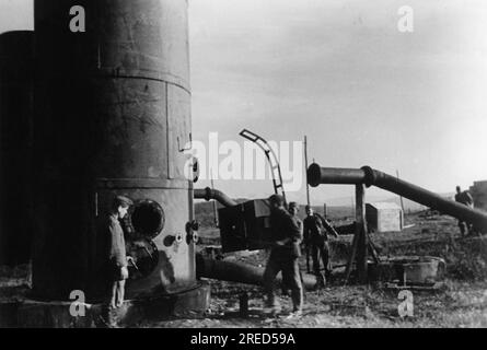 German soldiers at oil production facilities destroyed by Russian ...
