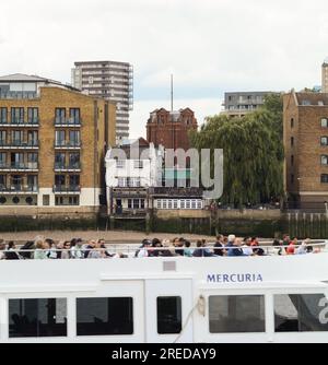 Cruise boat passing the Prospect of Whitby Thames Stock Photo - Alamy