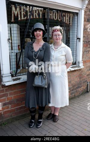 The Ironbridge World War Two Weekend. Sisters dressed in 1940s style walking over the world's ...