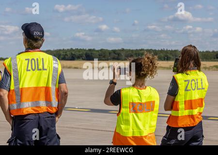 Customs officers wearing high-visibility waistcoats, Schoenefeld ...