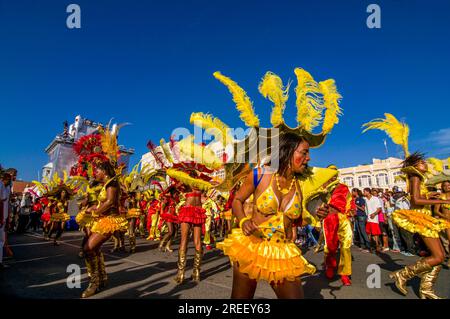 Colourful costumed, pretty women are dancing. Carnival. Mindelo. Cabo ...