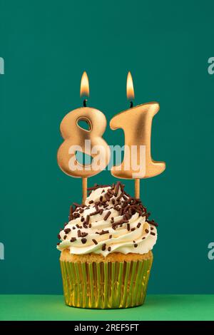 Birthday candle number 81 - Anniversary cupcake on black background ...