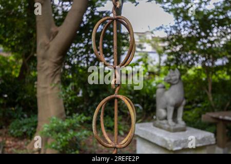 Rings on a traditional Japanese rain chain, or kusaridoi, at Kasuga ...